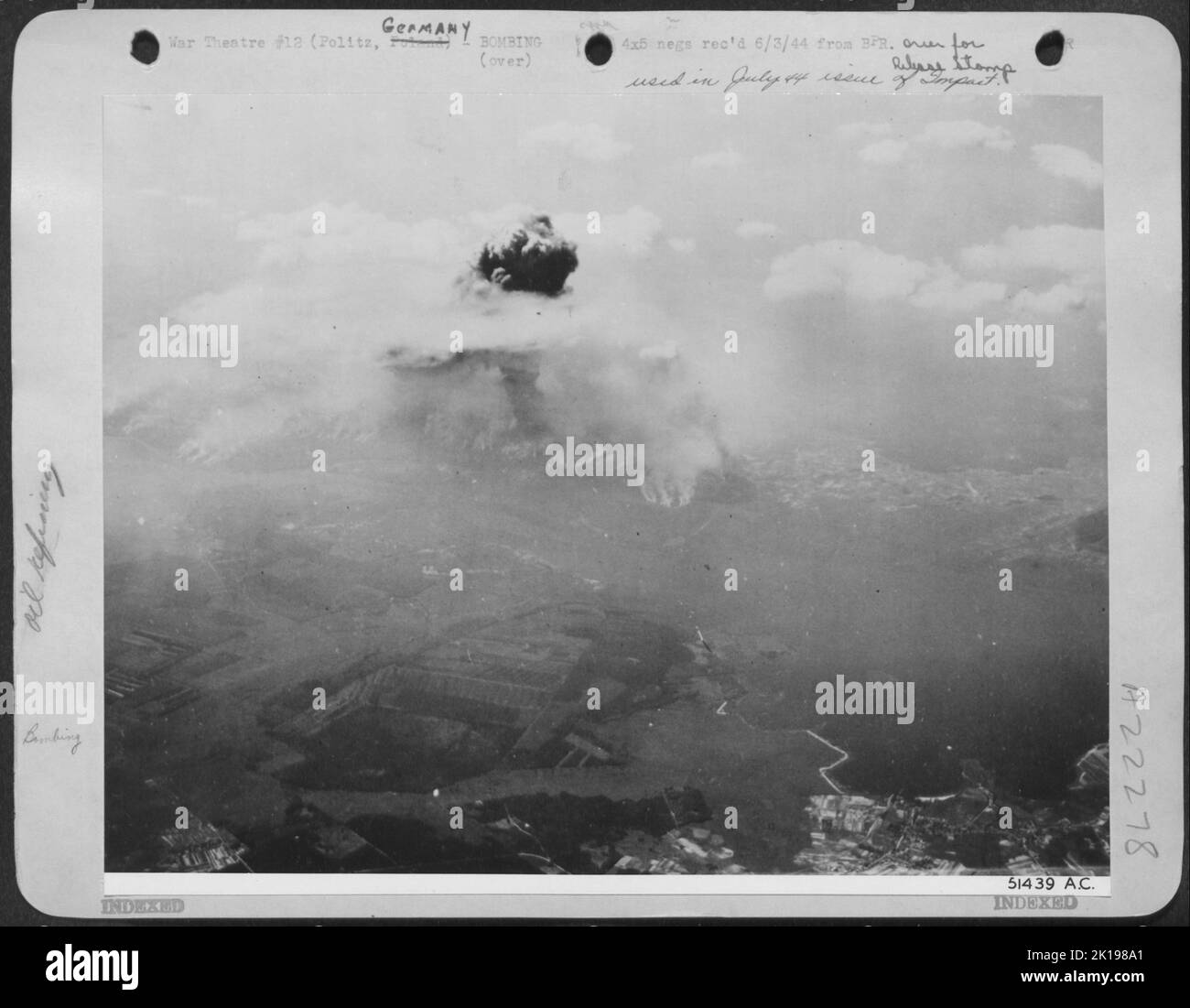 Looking like an on-rushing tornado, a huge column of smoke looms above ...