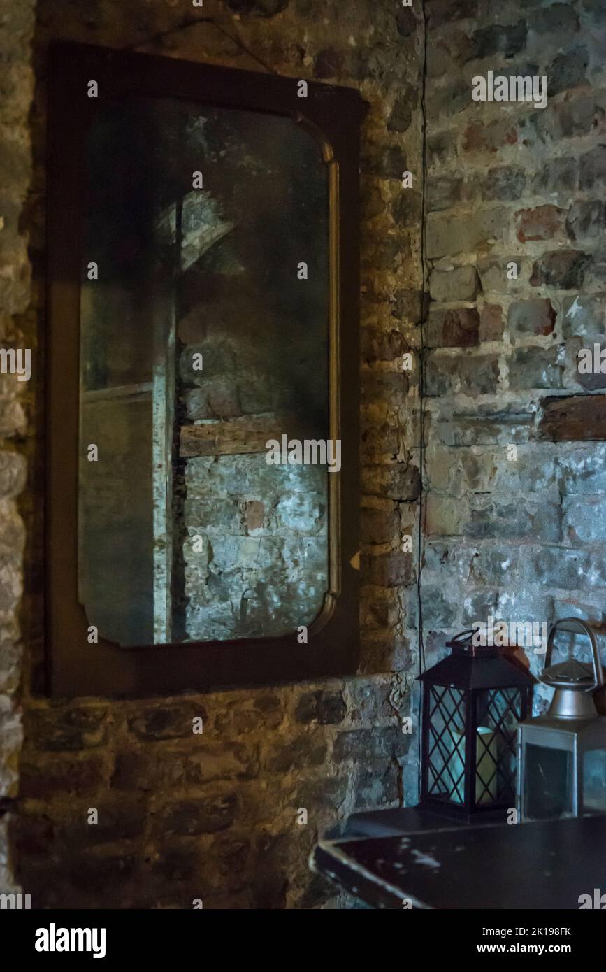 Old damaged mirror on brick wall, London, England, UK Stock Photo - Alamy