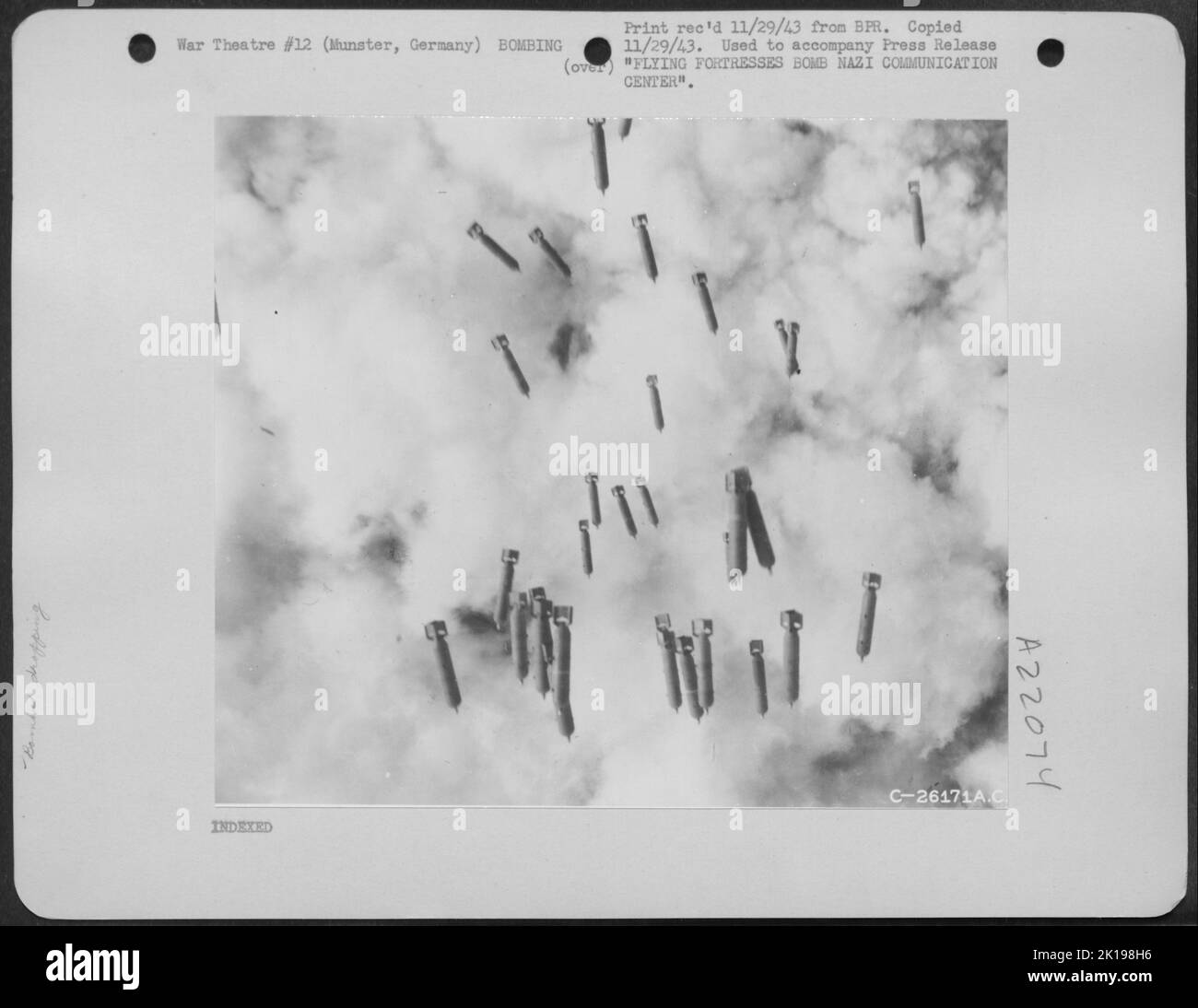 Falling rapidly toward the clouds and the earth below, these bombs from ...