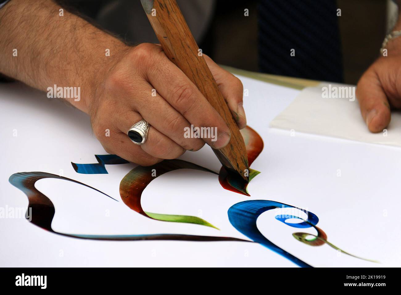 Hammana, Lebanon - June 6, 2017:A calligraphy artist and his Arabic ...