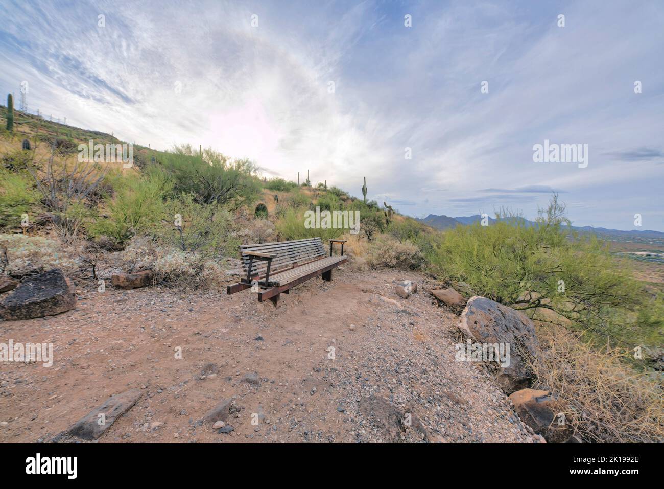 Wooden long bench on a slope with an overlooking view in Tucson ...