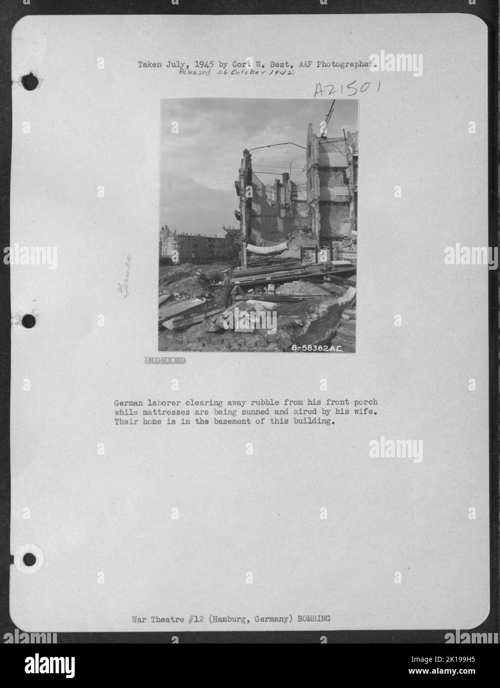 German Laborer Clearing Away Rubble From His Front Porch While ...
