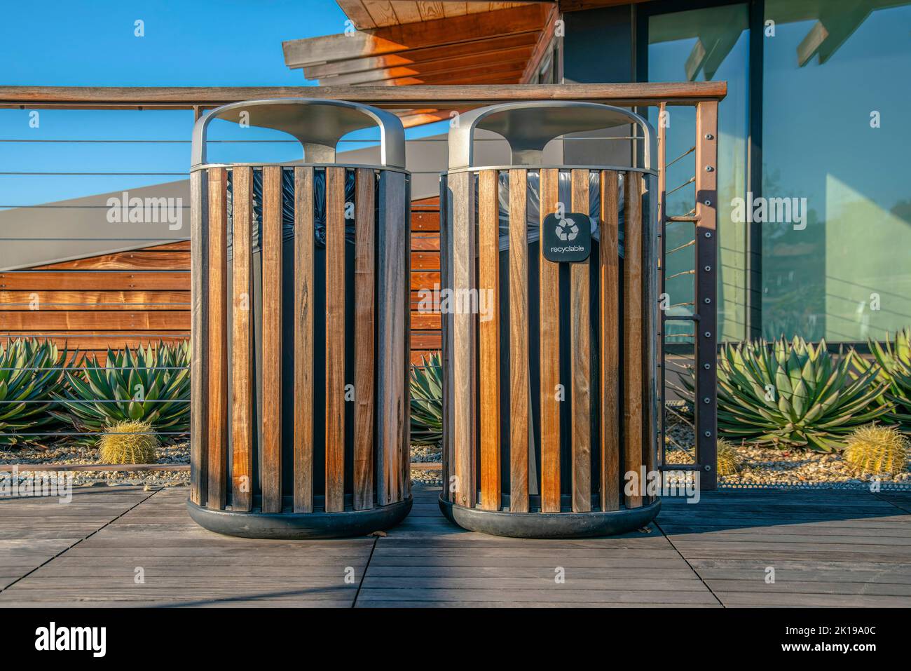 La Jolla, California- Two trash cans with wood planks. Wooden trash ...