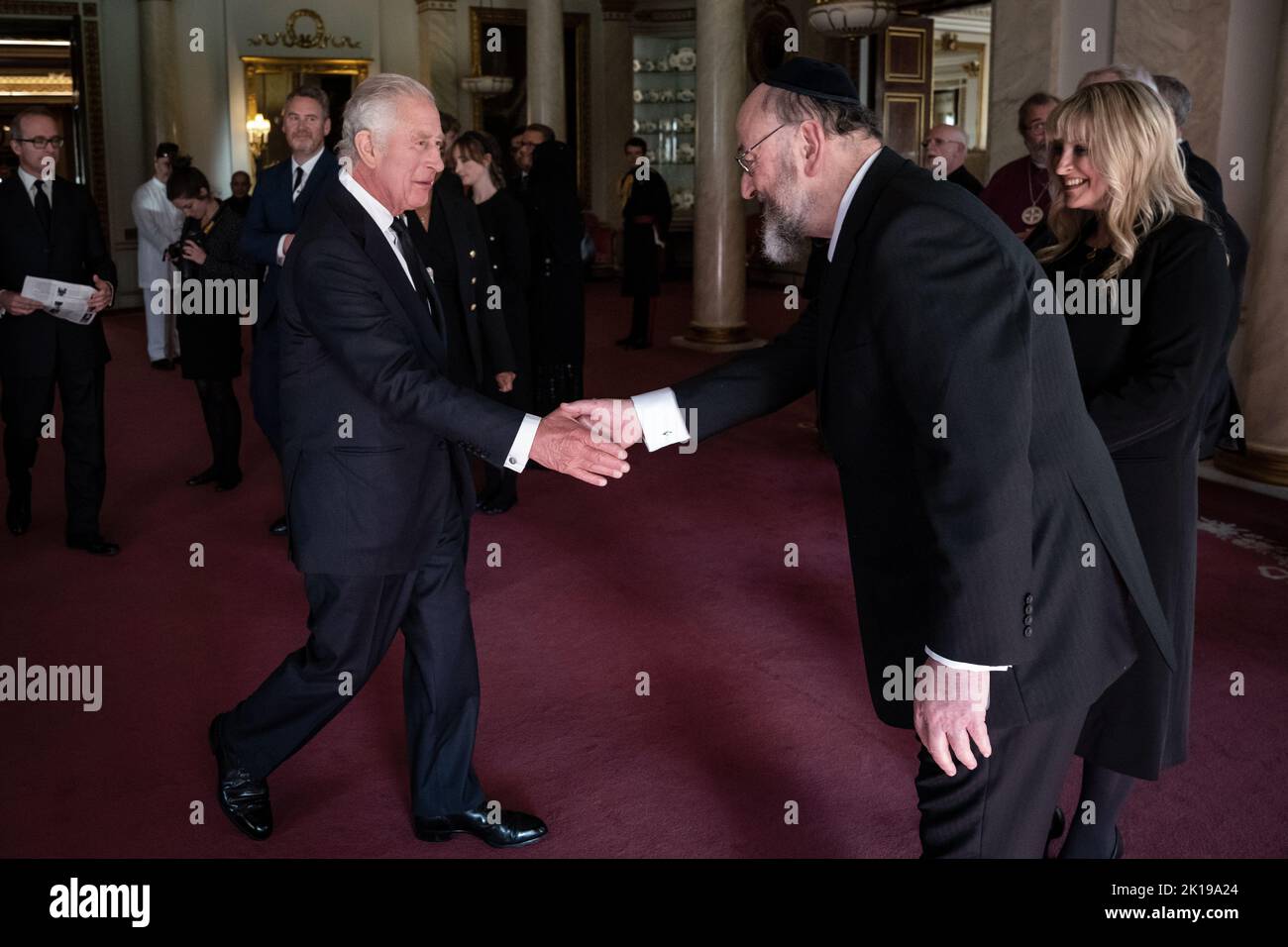 King Charles III speaks to Chief Rabbi Ephraim Mirvis as he meets with ...