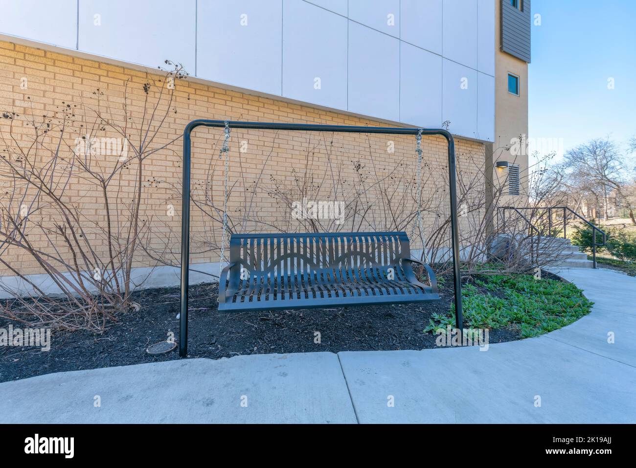 San Antonio, Texas- Hanging metal bench outside the building. Hanging ...