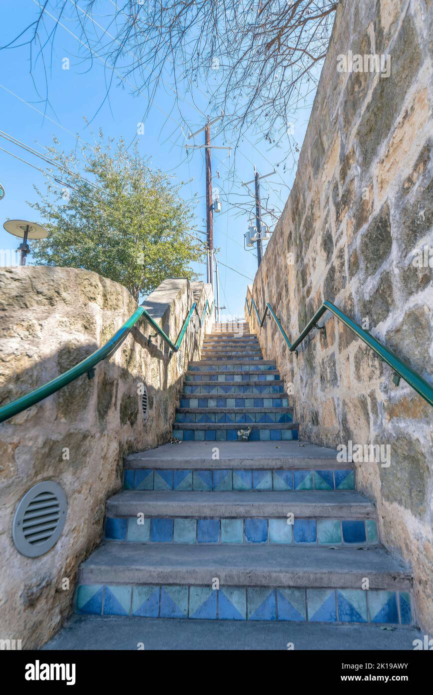San Antonio, Texas- Narrow stairs with blue ornate riser tiles and wall ...