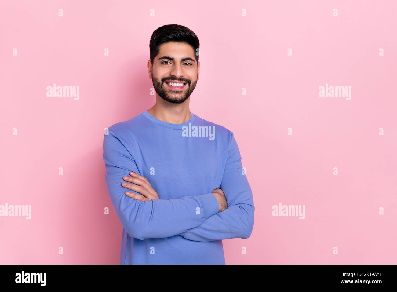 Photo of confident attractive arab guy dressed blue pullover arms ...