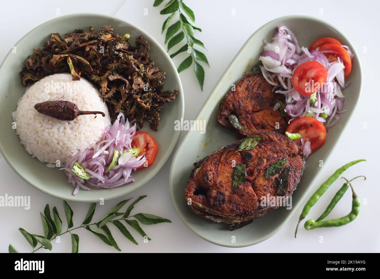 Crispy Surmai fish fry served with white rice meal along with fried ...