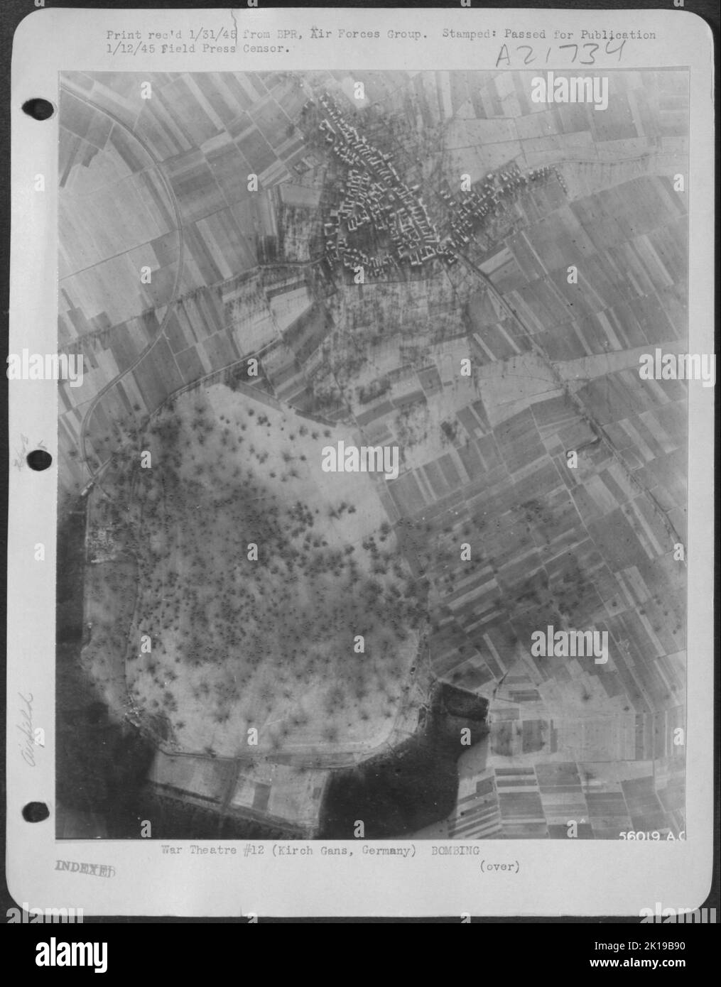 Hundreds of bomb craters pattern the German airfield at Kirch Gans ...