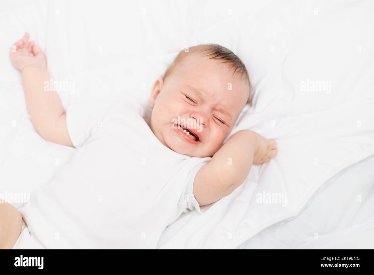 The baby is crying in his crib . The baby 's teeth are teething . Colic ...
