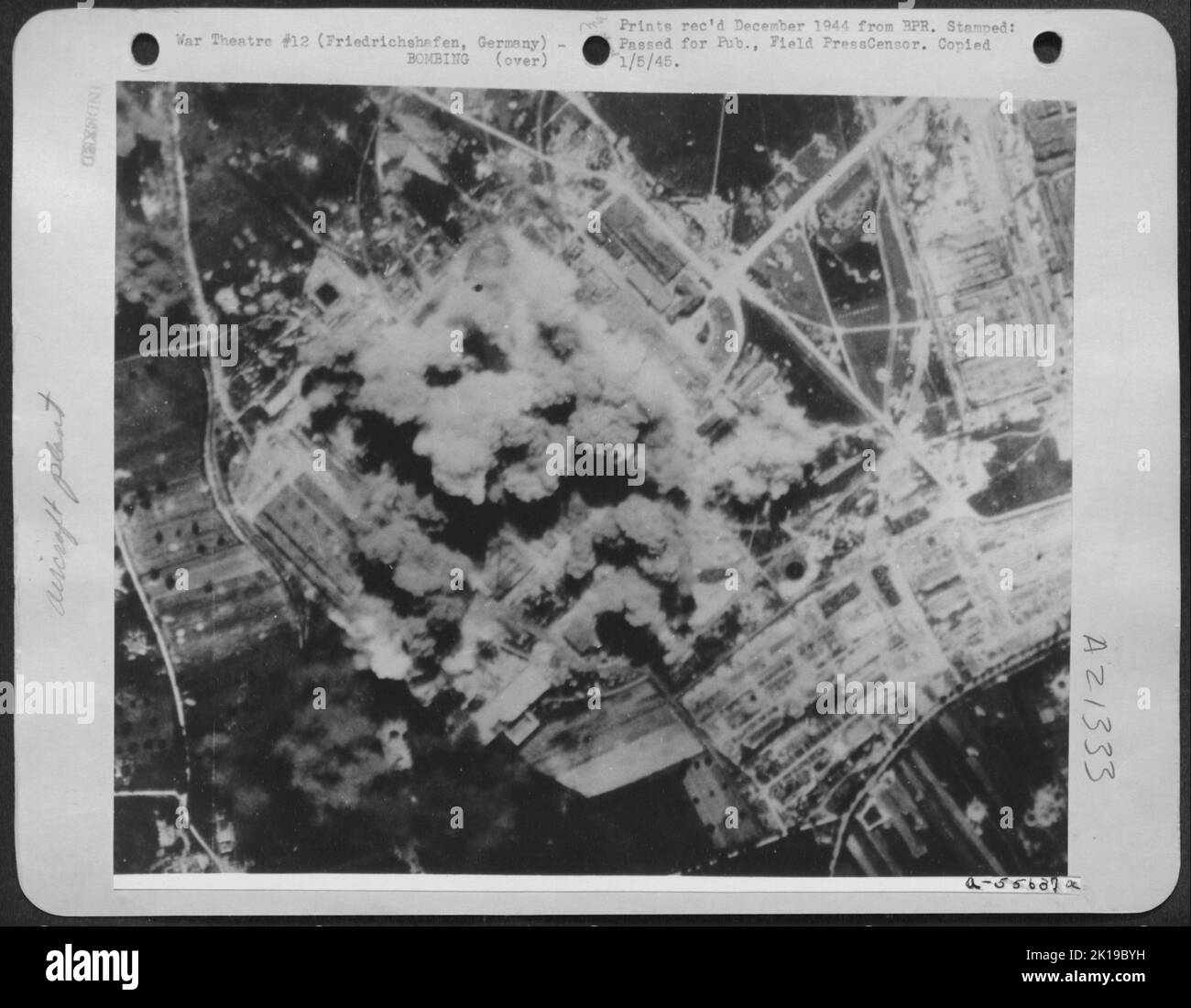 A close pattern of 15th AAF bombs cover the Zeppelin Works at ...