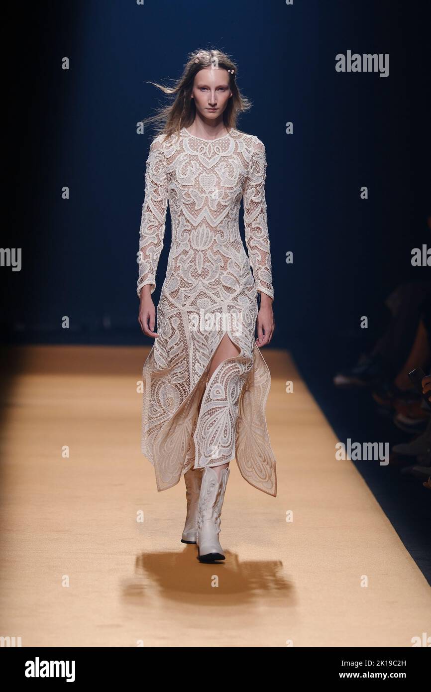 Madrid, Spain. 16th Sep, 2022. A model walks the runway wearing a ...