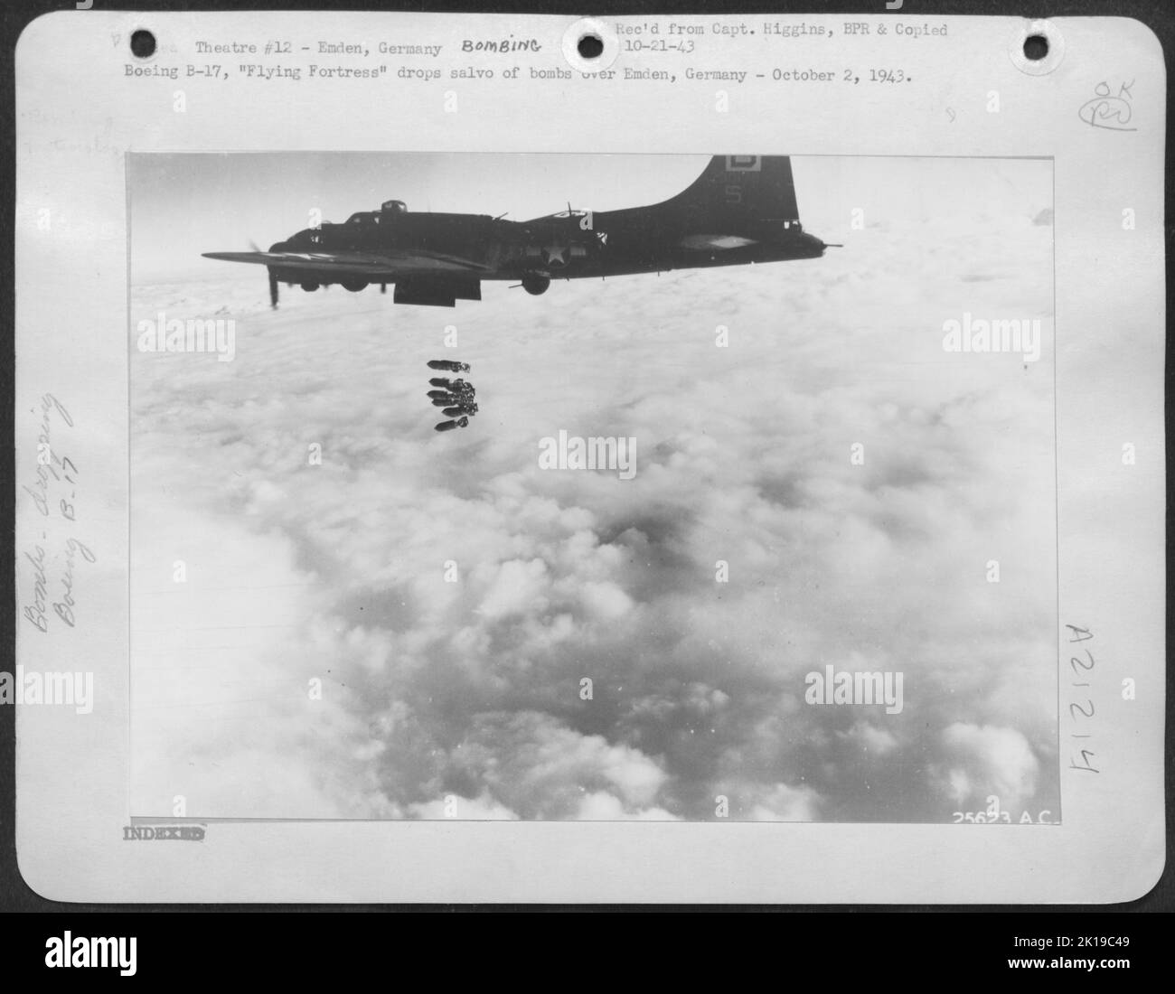 Boeing B-17, "Flying Fortress" drops salvo of bombs over Emden, Germany ...