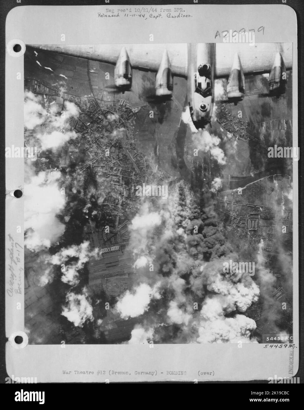 Bursts of high explosives and incendiary bombs are seen in the Focke ...
