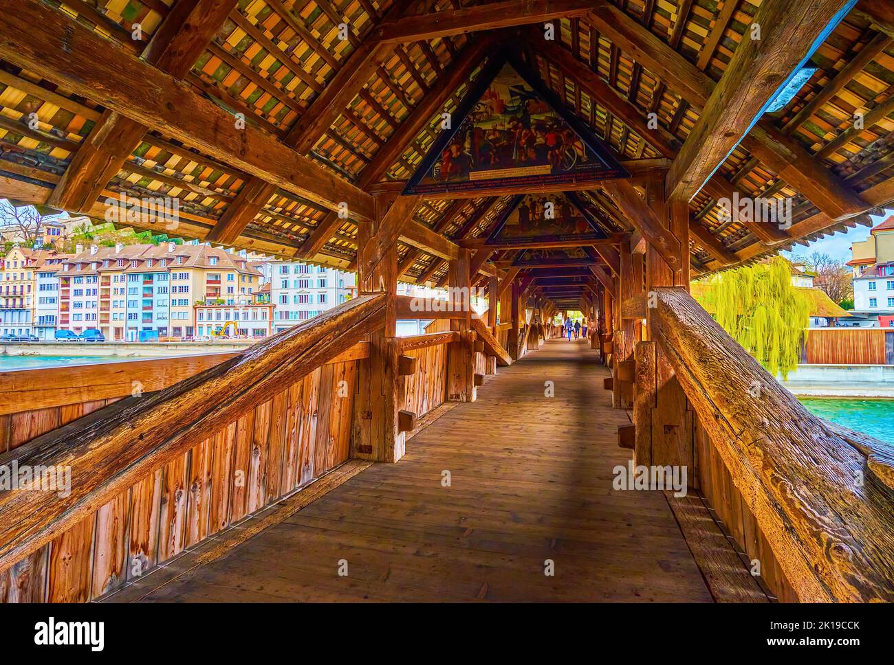 Walk along wooden covered Spreuerbrucke, the preserved medieval bridge ...