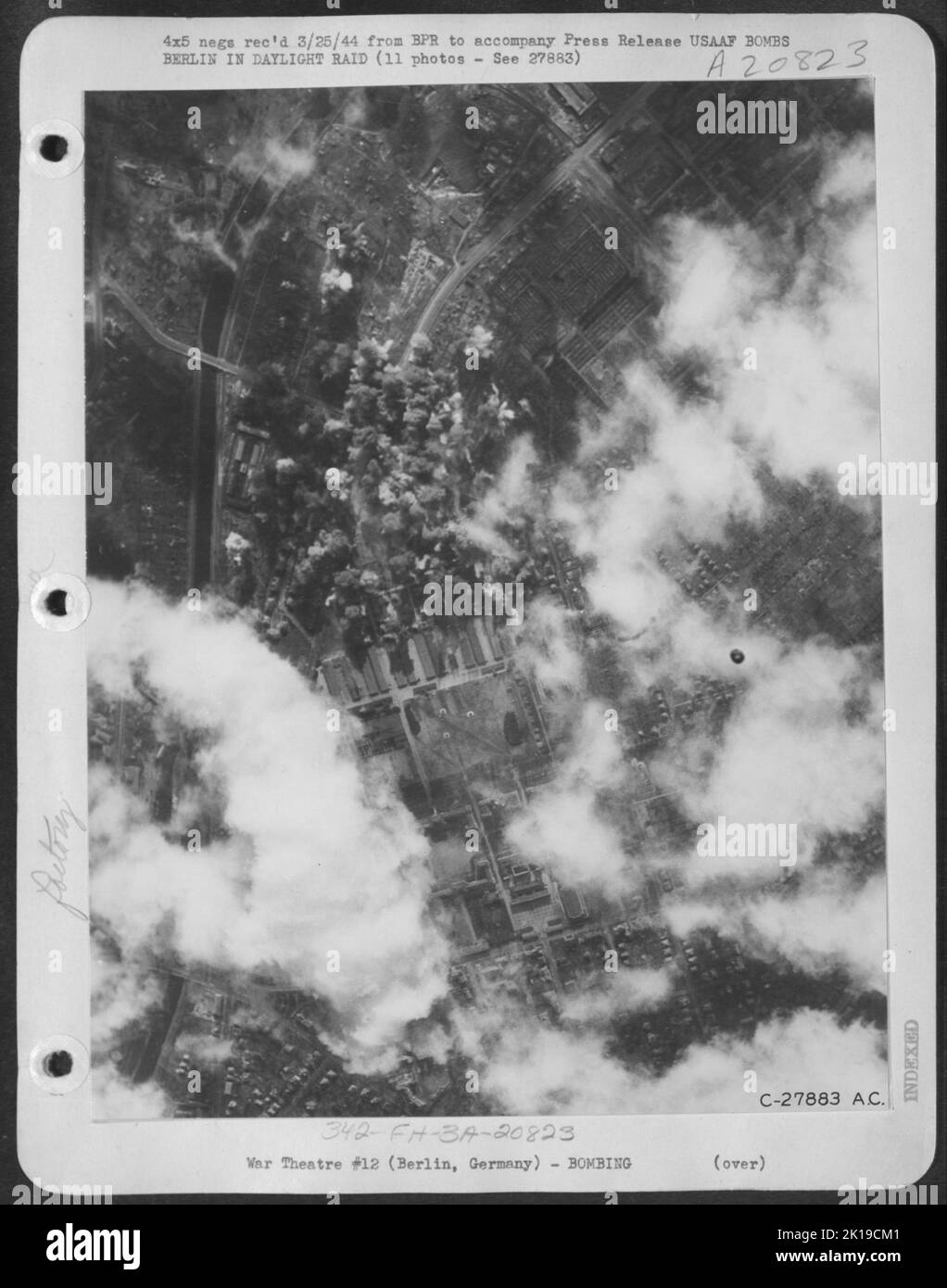 Bombs from U.S. Army Air Force Flying Fortresses and Liberators fall on ...