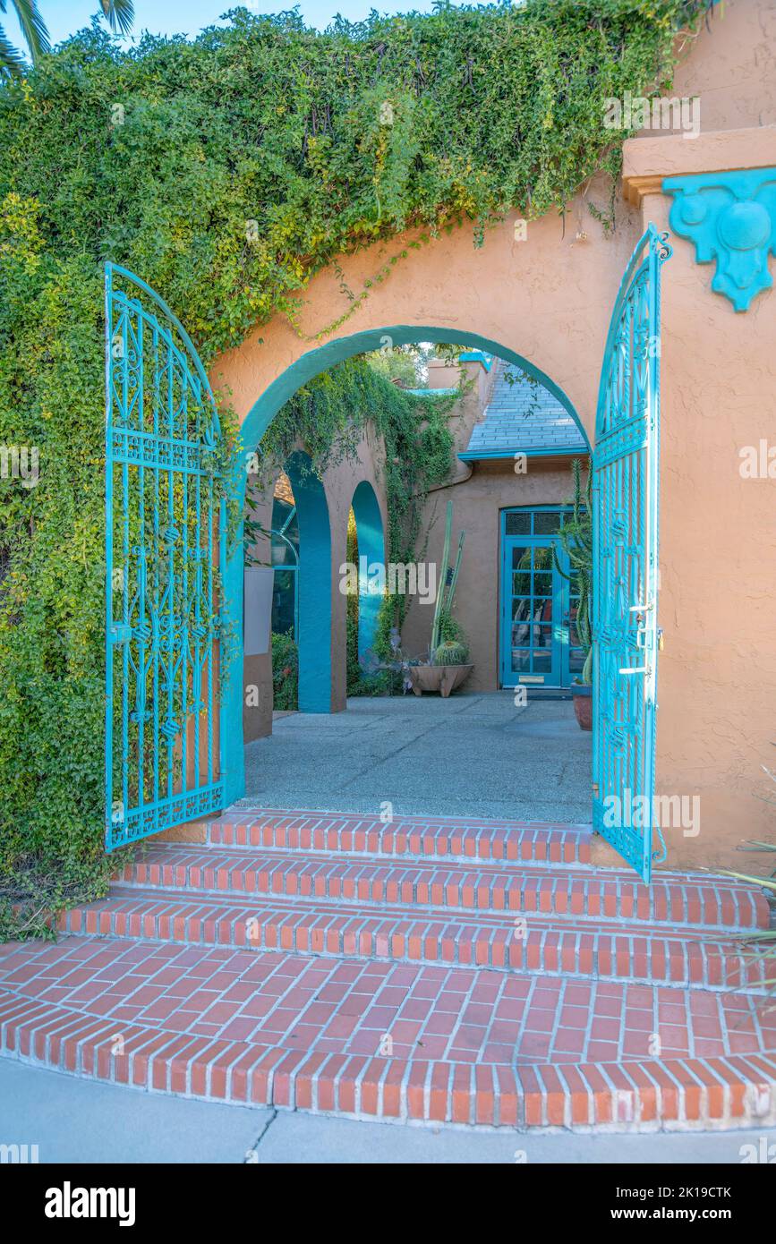 Downtown Tucson, Arizona- Arch entrance with bricks stairs and painted ...