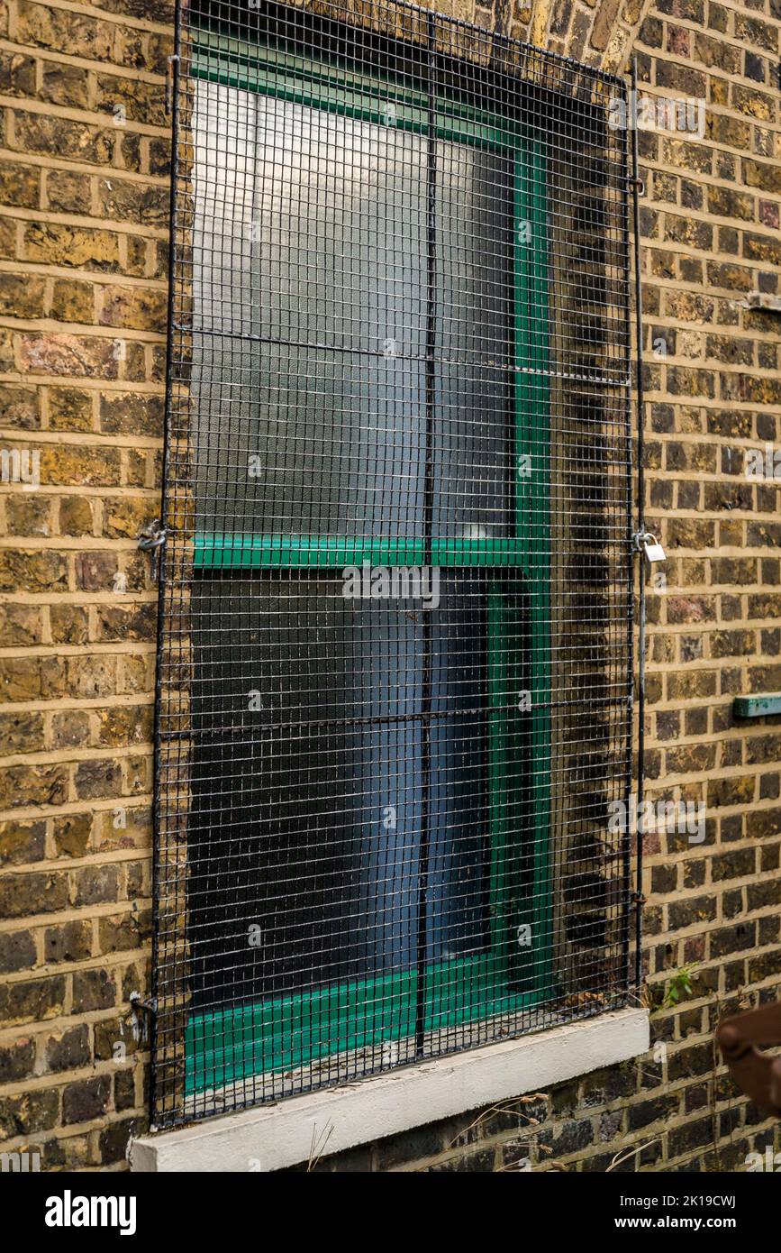 Window protected with wire mash, Walthamstow, London, England, UK Stock ...