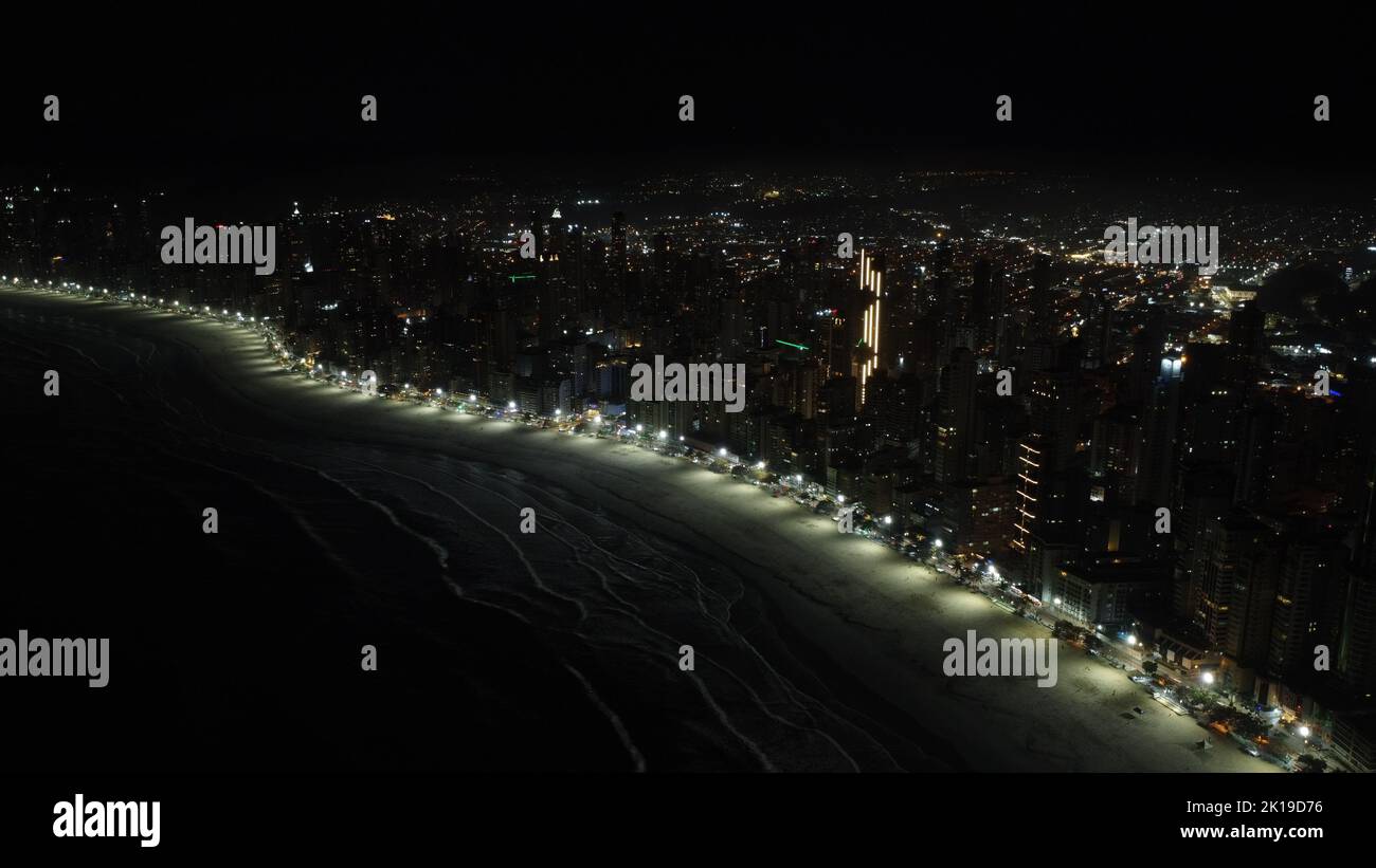 Aerial view of seaside Balneario Camboriu cityscape, illuminated ...