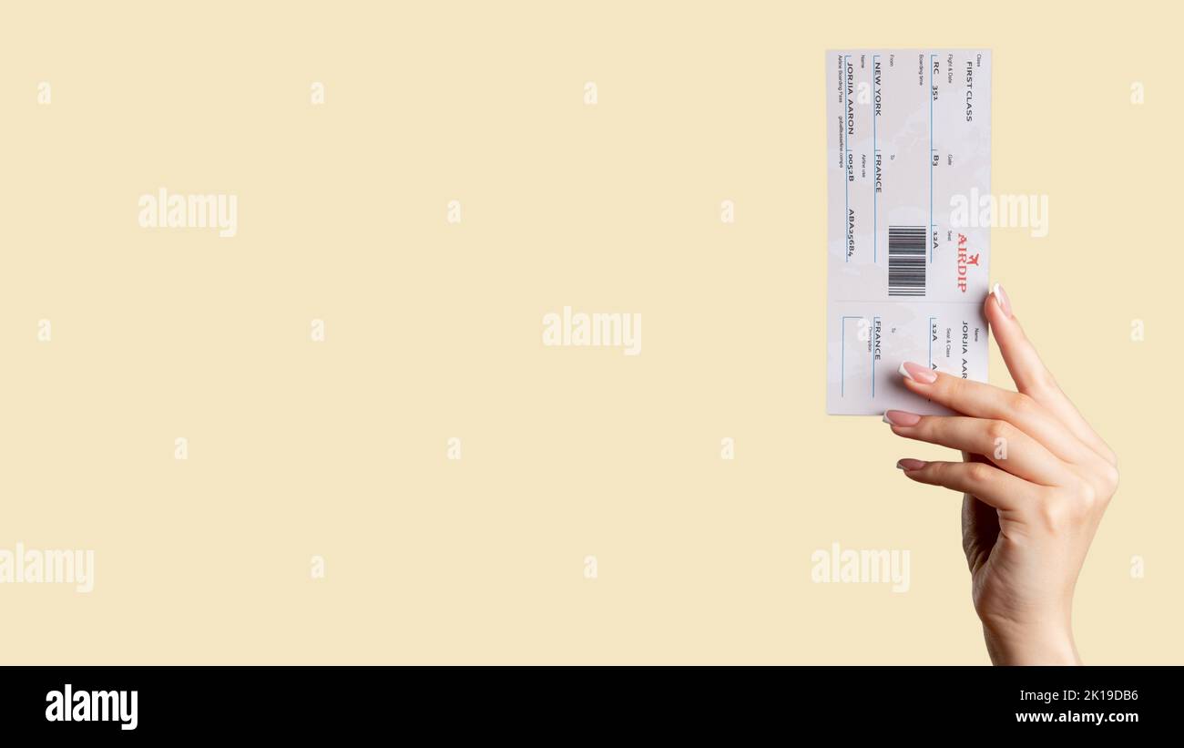 Boarding pass. International flight. Female hand holding first class ...