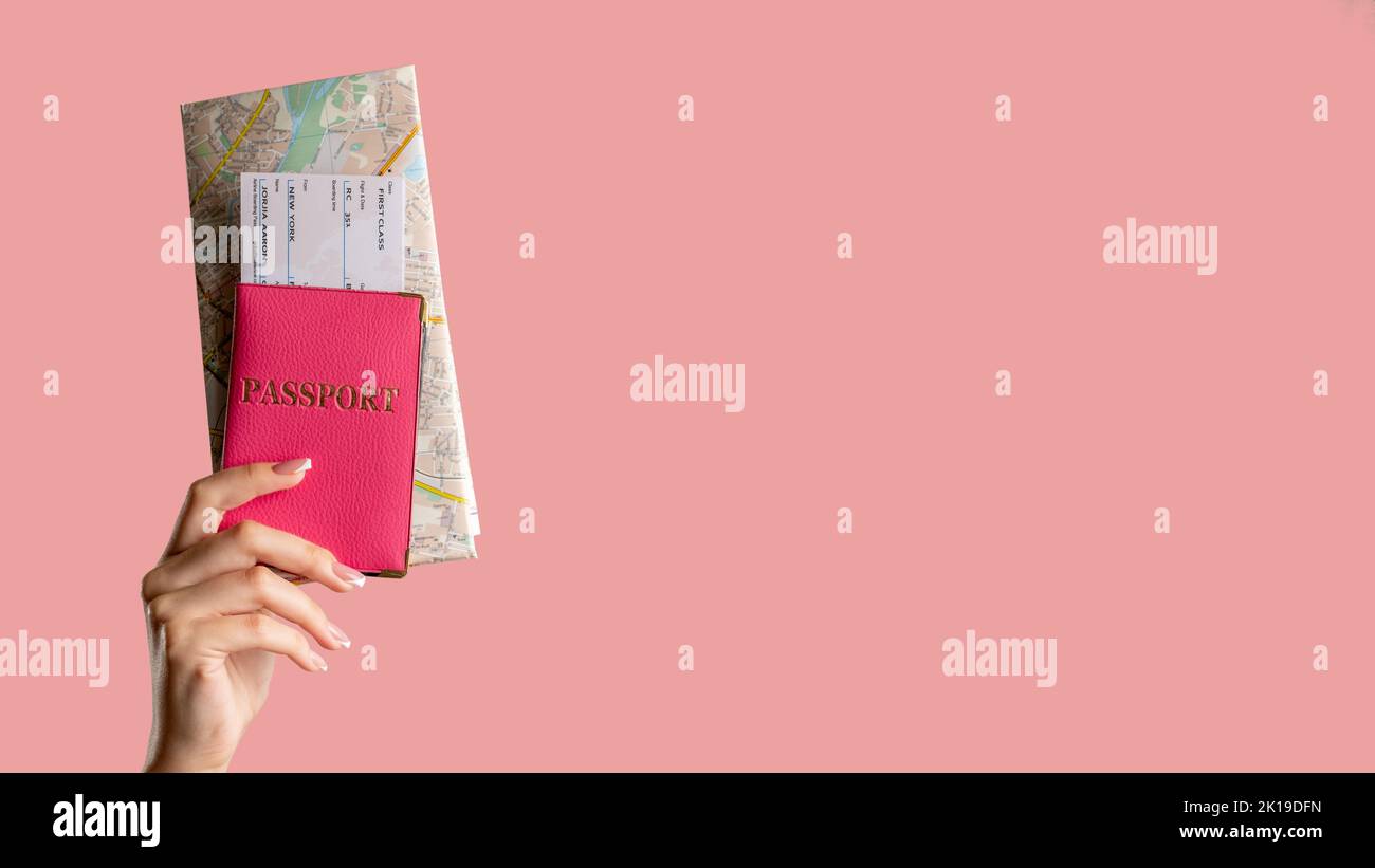 World tourism. Holiday journey. Female hand holding passport in cover ...