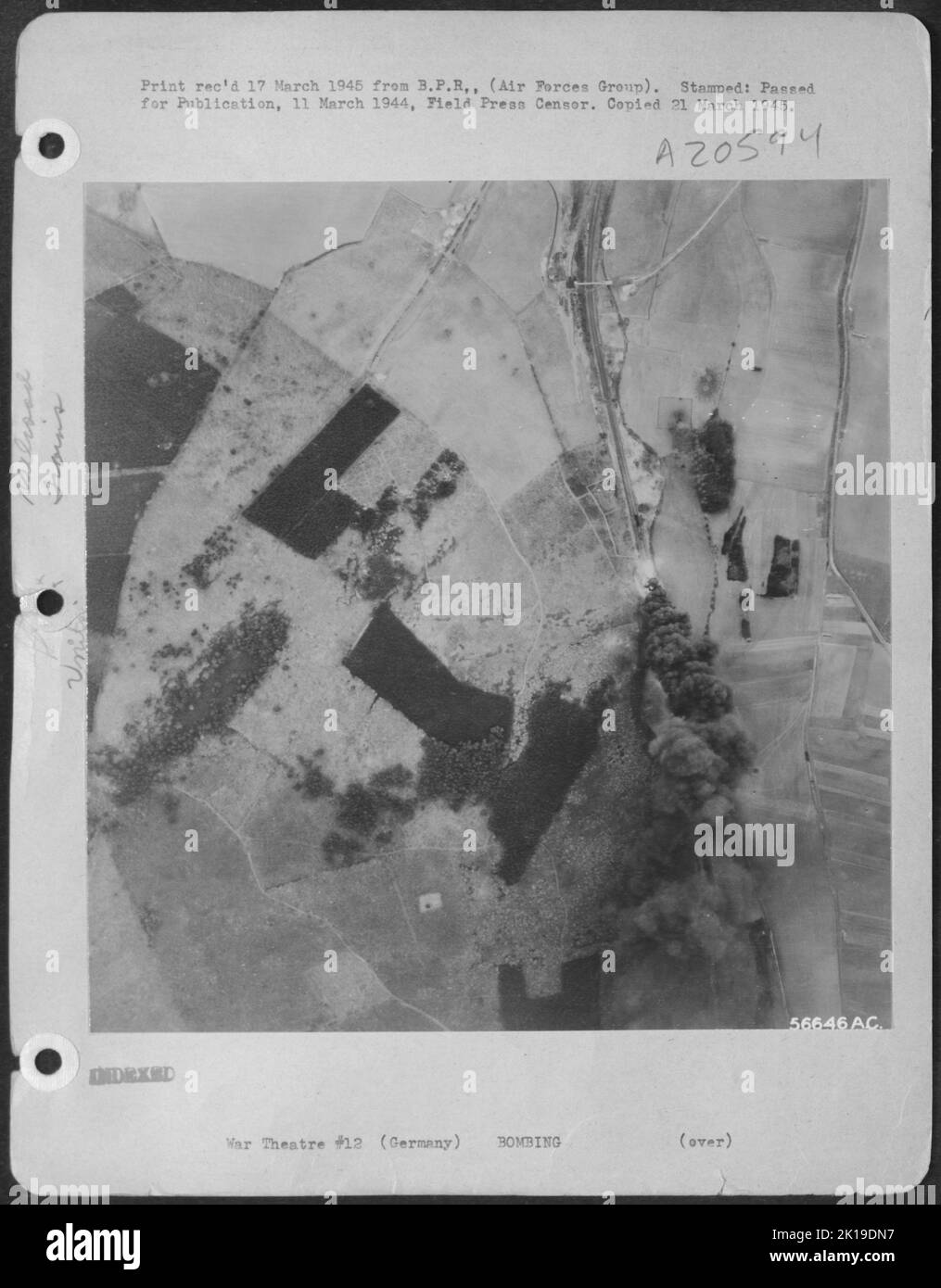 A direct hit, from a Ninth Air Fighter-bomber, exploding among cars of ...