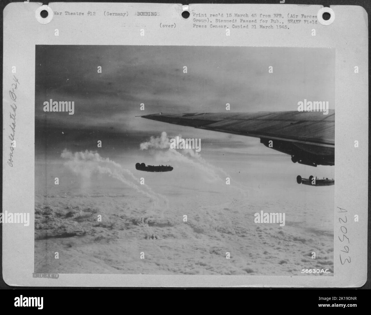 As these Consolidated B-24 Liberators near the target, obscured by ...