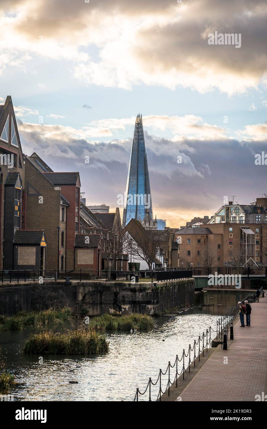 New housing development along a canal and and the Shard skyscraper in ...