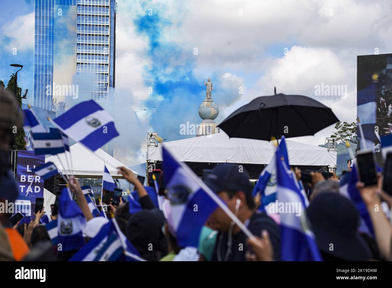 Salvadorans gesture and cheer during a military parade on the ...