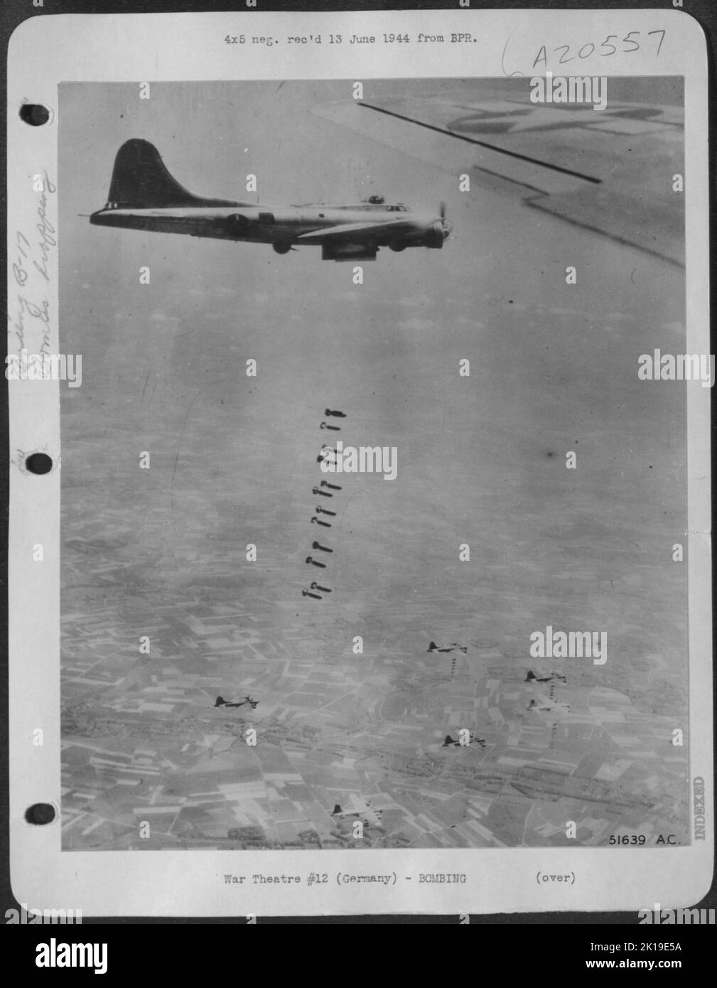 TEAMWORK--Bombs can be see dropping from the bomb bay doors of these ...