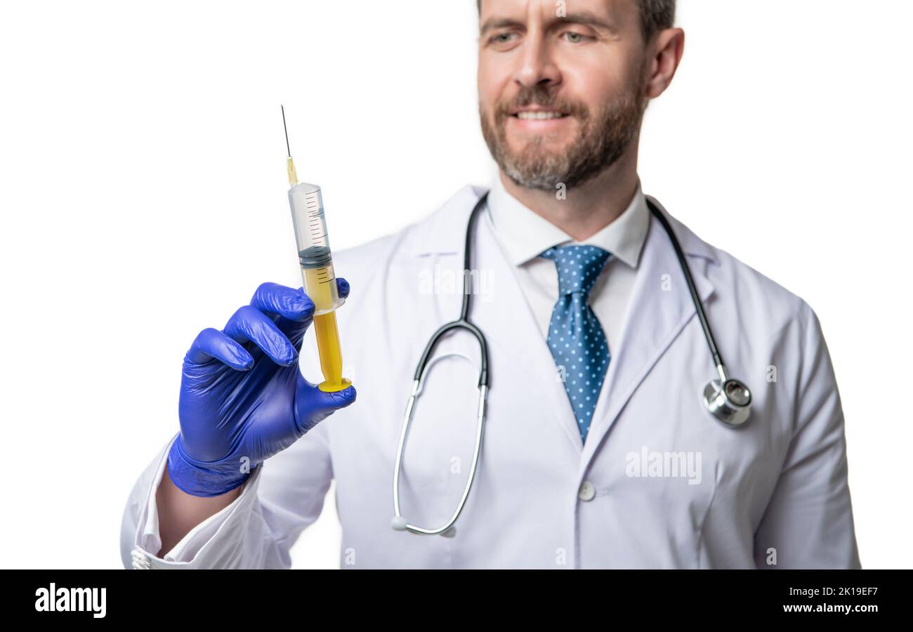 Man doctor holding medical syringe. Medic prepared injection syringe ...