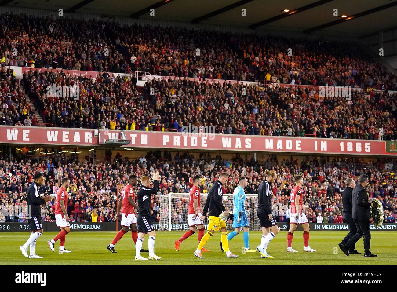 Nottingham Forest and Fulham players and managers walk onto the pitch ...