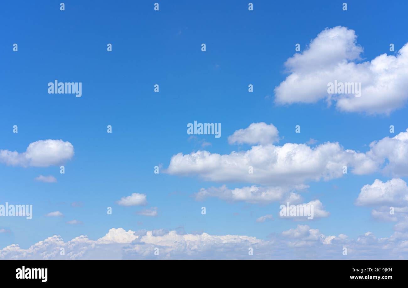 Clear blue sky background with white clouds Stock Photo - Alamy