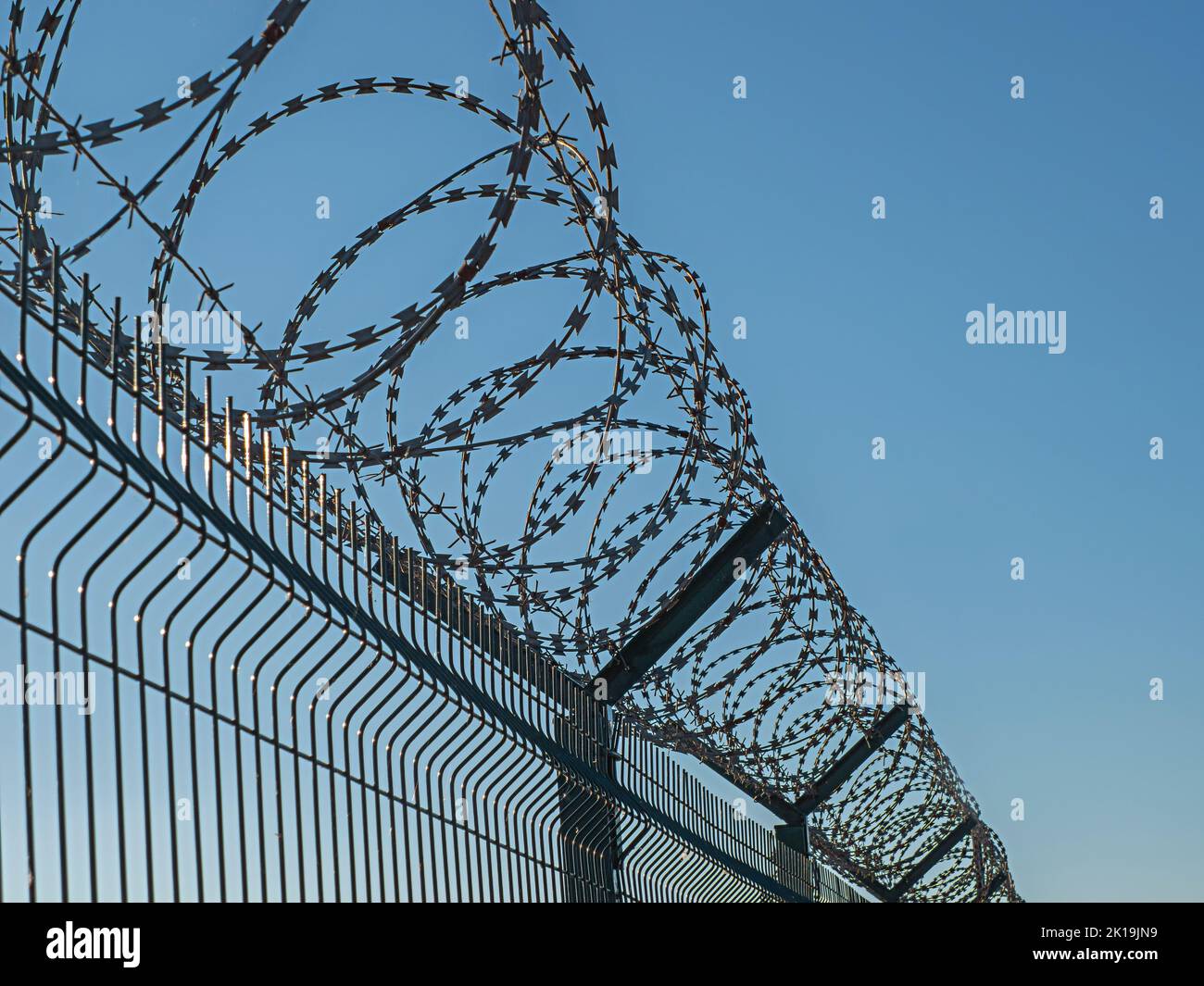 Barbed, razor wire - some coils of barbed wire razor fence Stock Photo ...