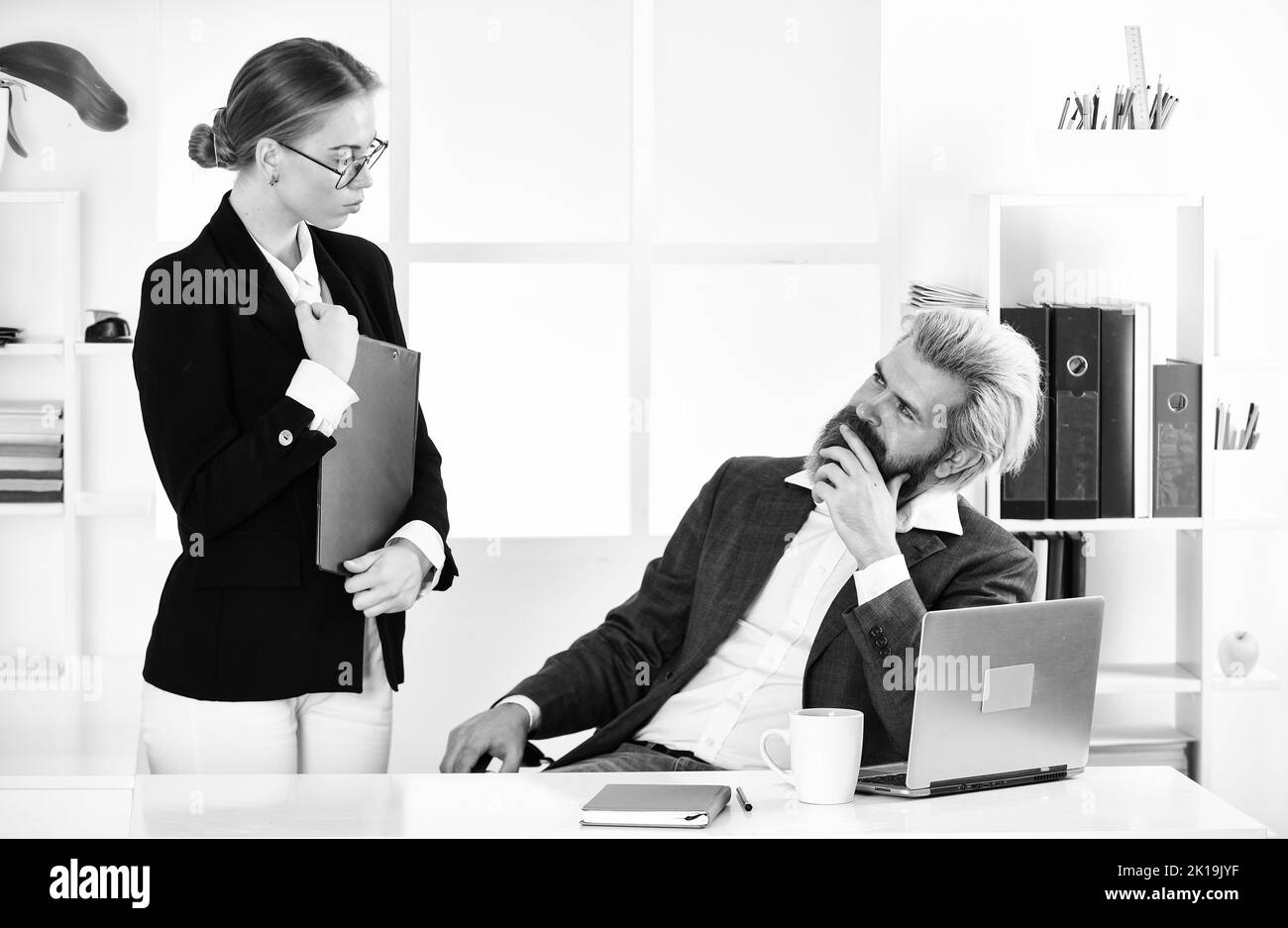 male boss with his secretary. office couple discuss business. modern ...