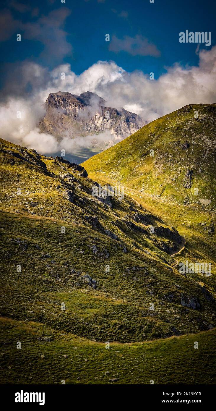 a vertical shot of the Austrian Alps in clouds Stock Photo - Alamy