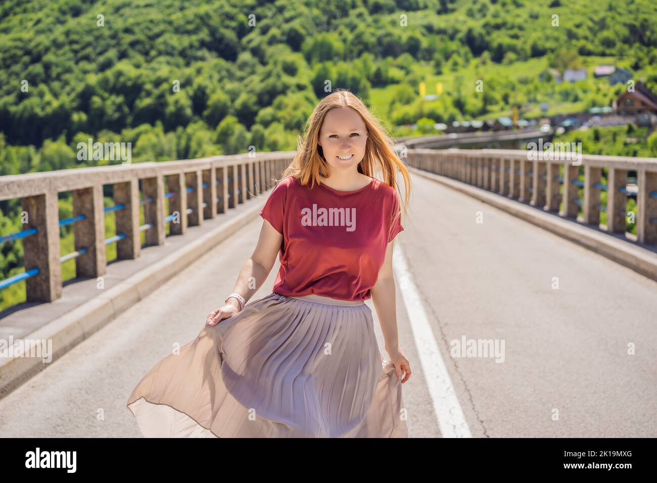 Montenegro. Woman tourist in background of Dzhurdzhevich Bridge Over ...