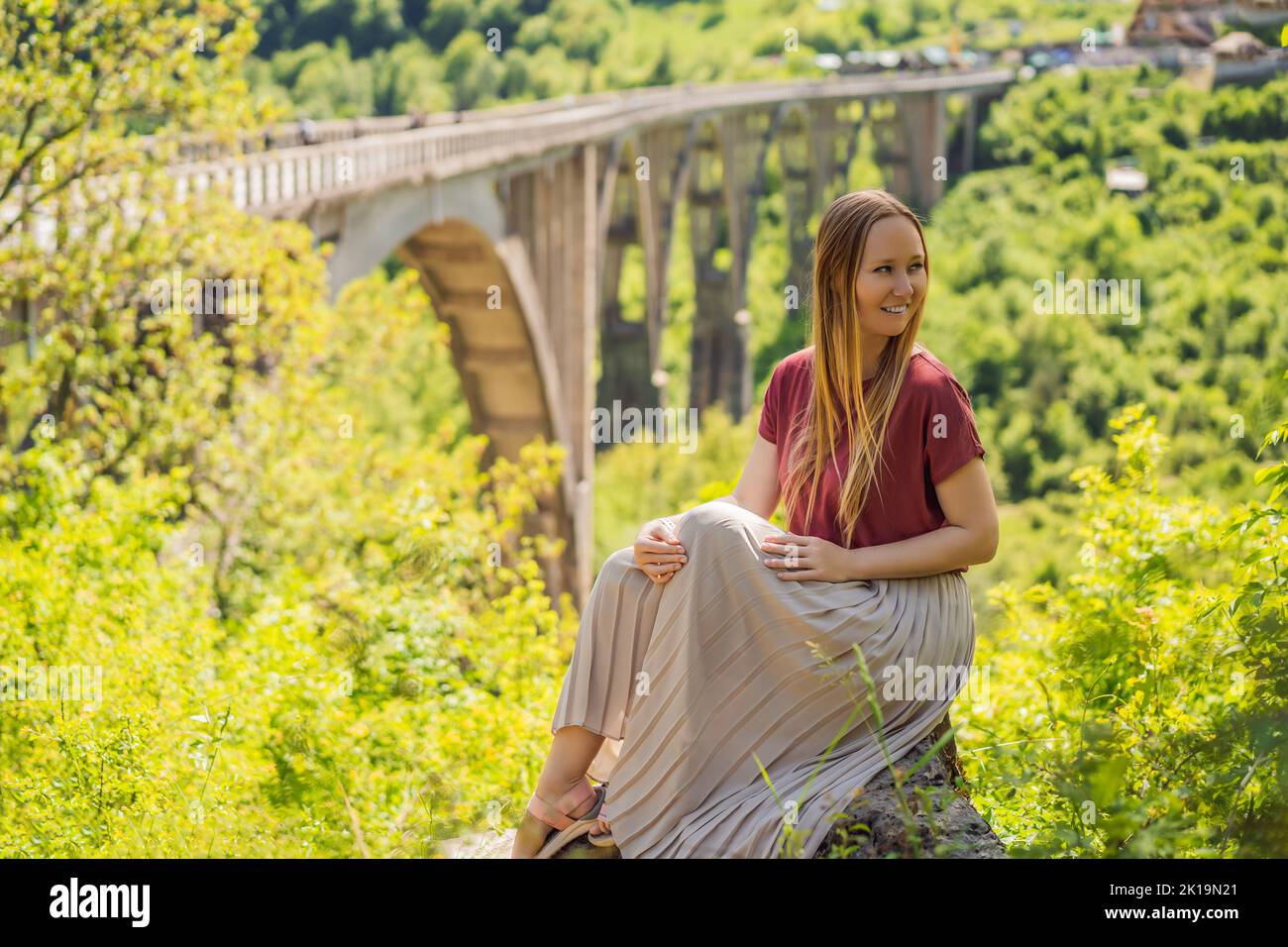 Montenegro. Woman tourist in background of Dzhurdzhevich Bridge Over ...