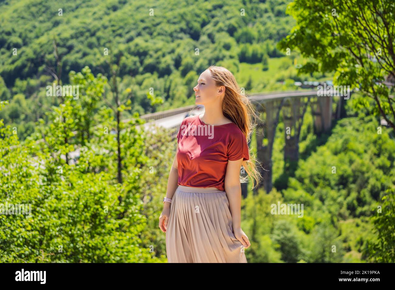 Montenegro. Woman tourist in background of Dzhurdzhevich Bridge Over ...