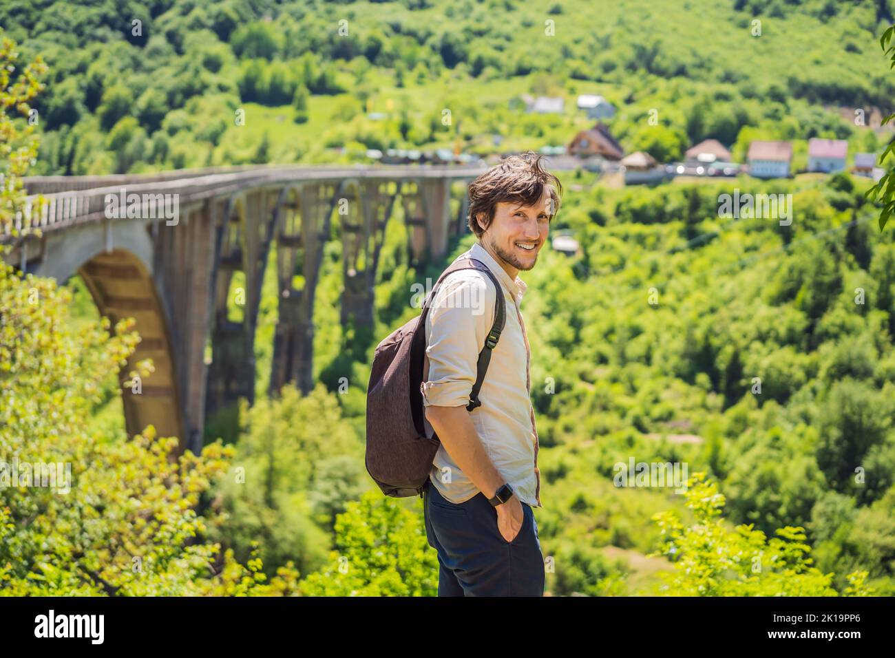 Montenegro. Man tourist in background of Dzhurdzhevich Bridge Over The ...