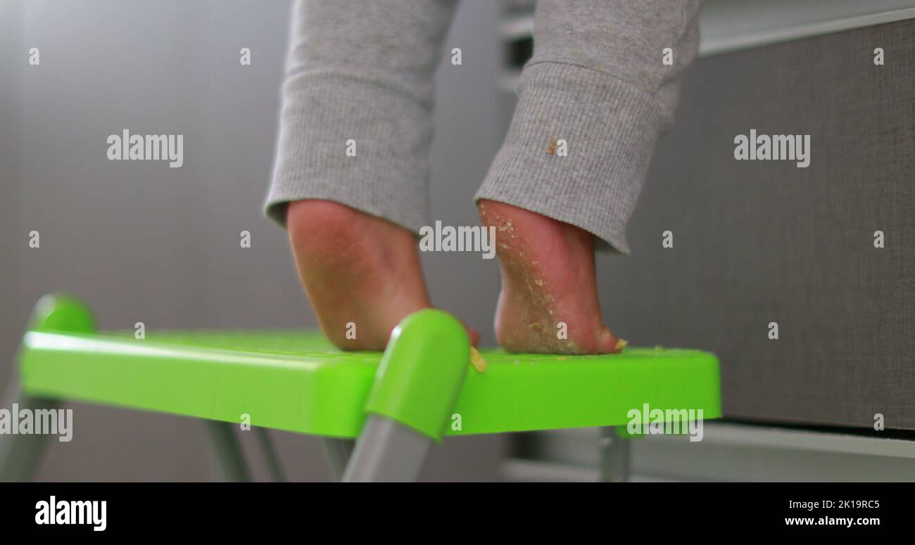 Baby standing on tiptoes reaching out, cute one year old infant on ...