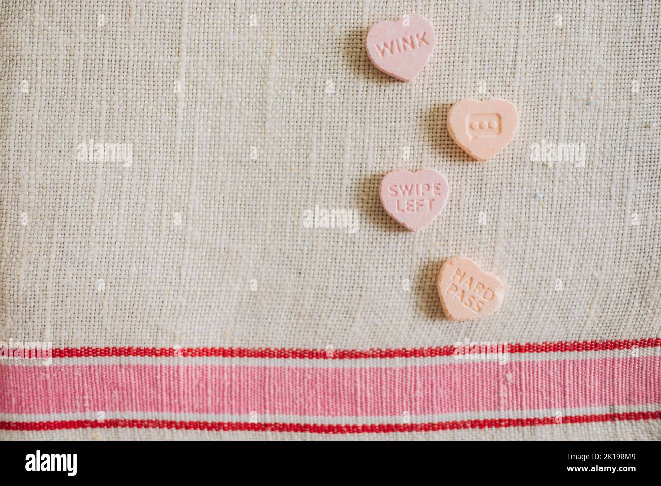 Valentine pastel candy conversation hearts with words on cloth, "swipe ...