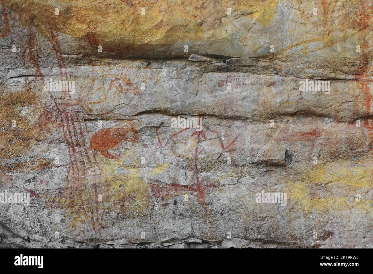 182 Aboriginal rock art. Red schematic female figure-wallabies red and ...