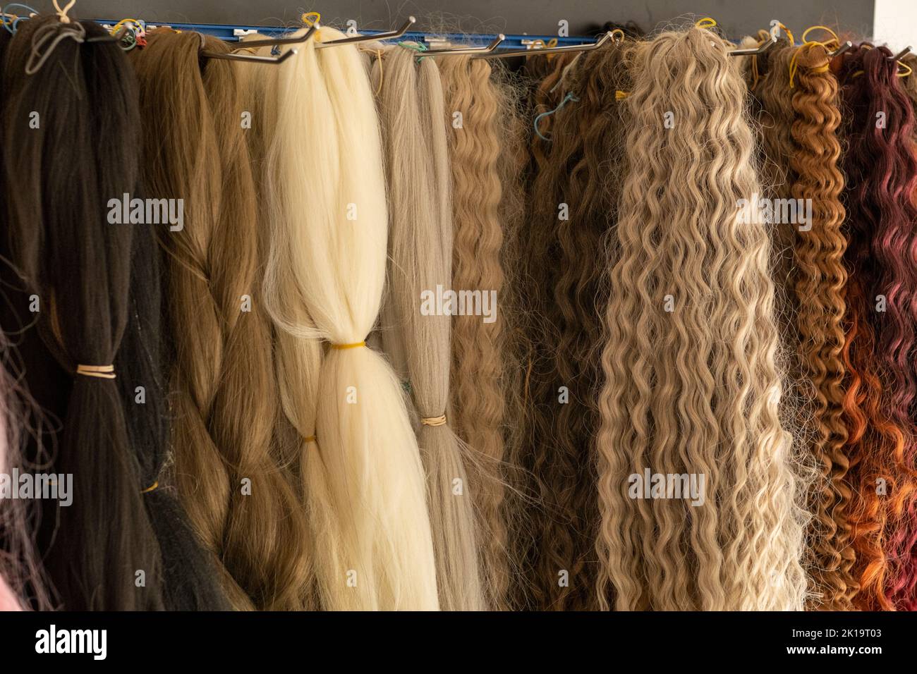 Many varieties of hair for hairstyles. Multicolored hair in beauty ...