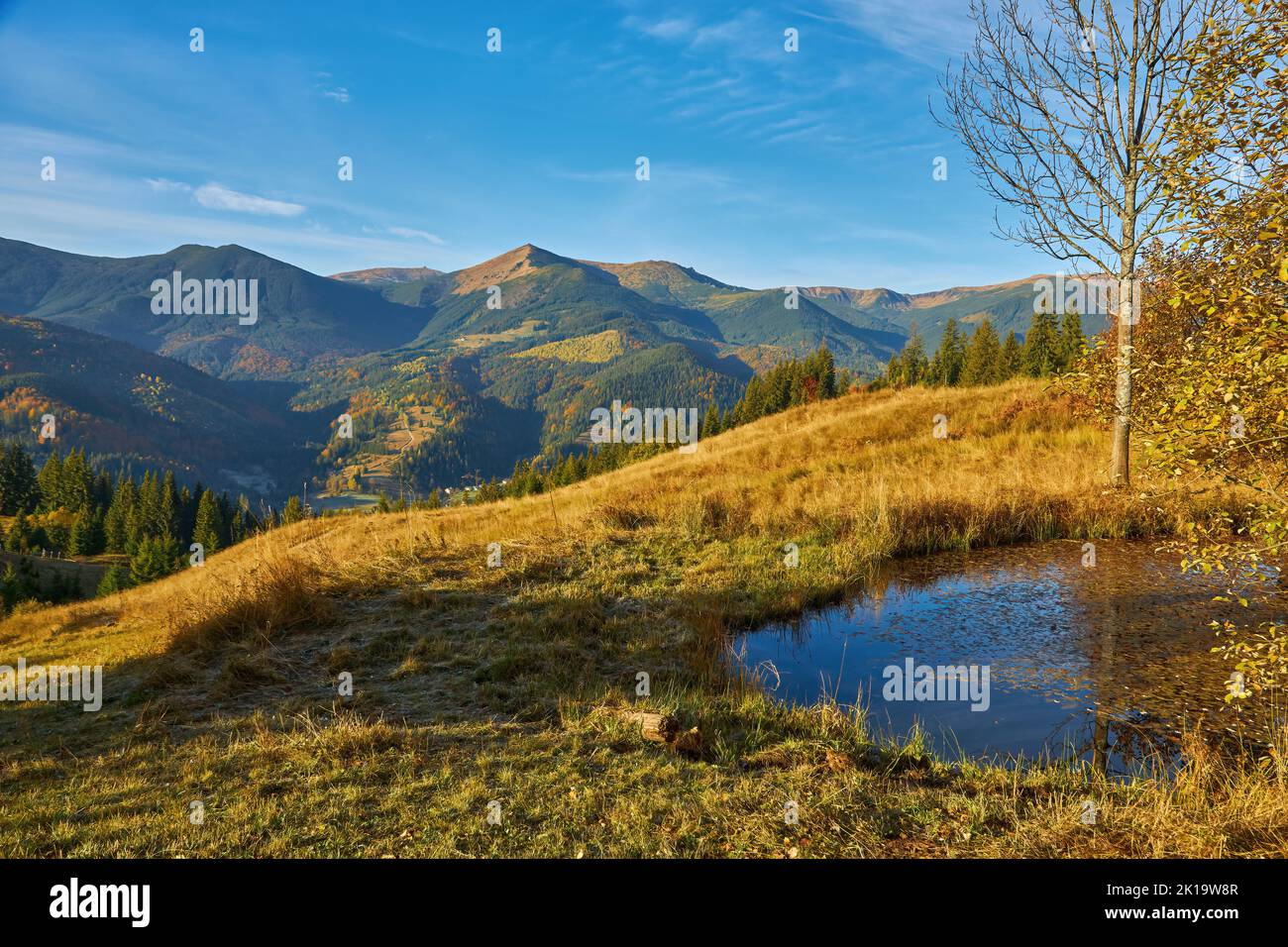 Amazing mountain landscape with colorful vivid sunset on the cloudy sky ...