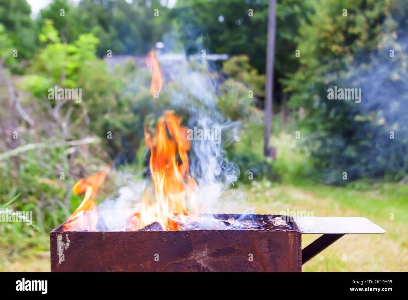 Flame of fire burning in the brazier Stock Photo - Alamy