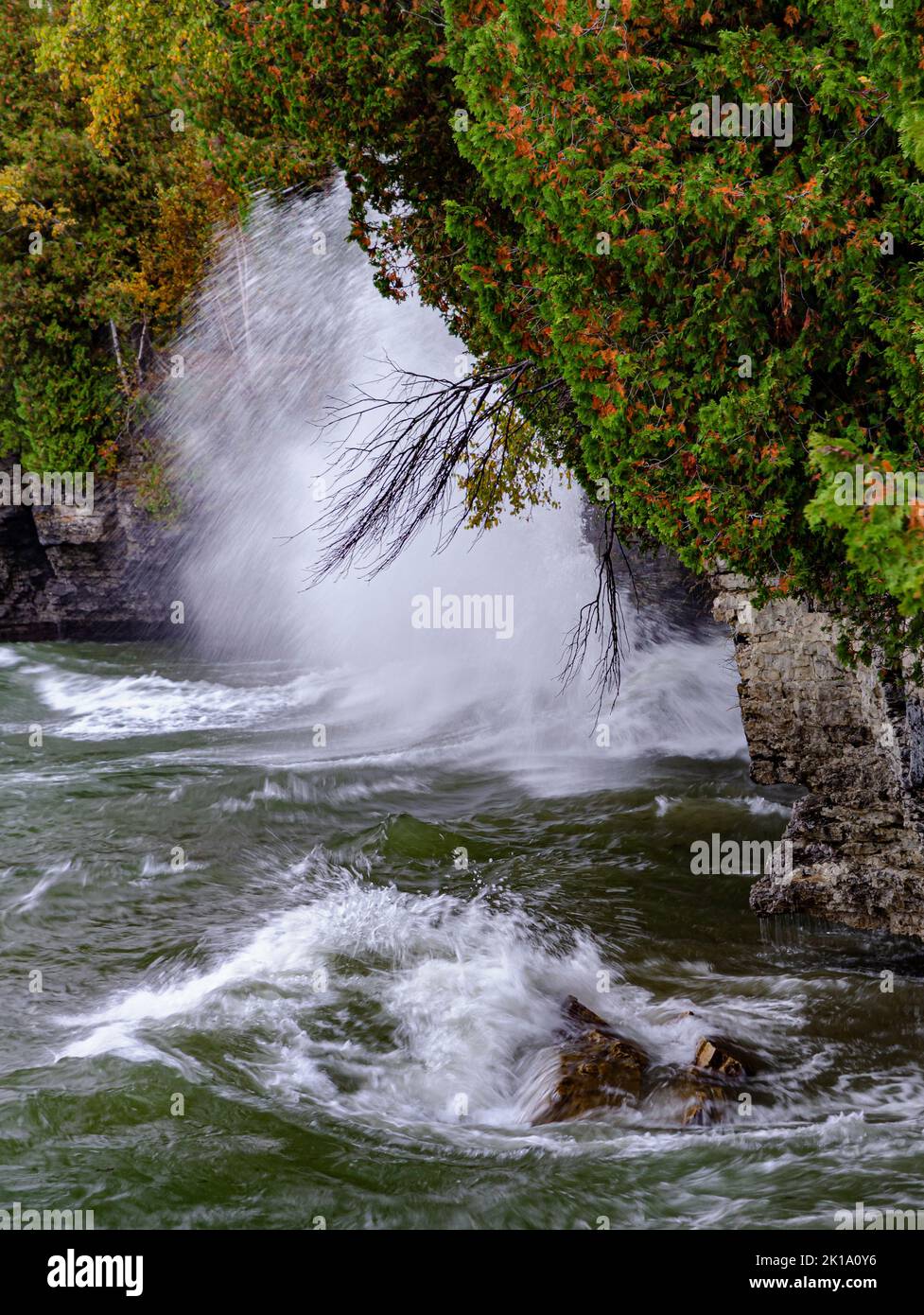 Waves pound the Cave Point County Park, Lake Michigan shoreline where ...