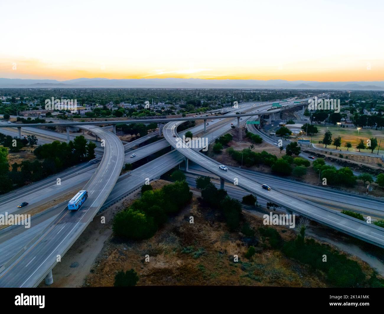 An aerial view of expressway in a city during sunset Stock Photo - Alamy