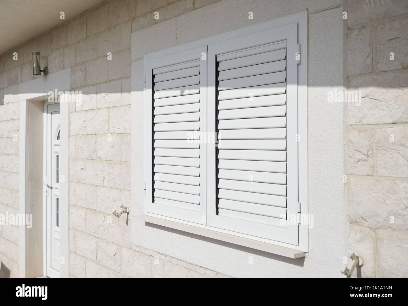 Plastic external window shutters for sun shade Stock Photo - Alamy