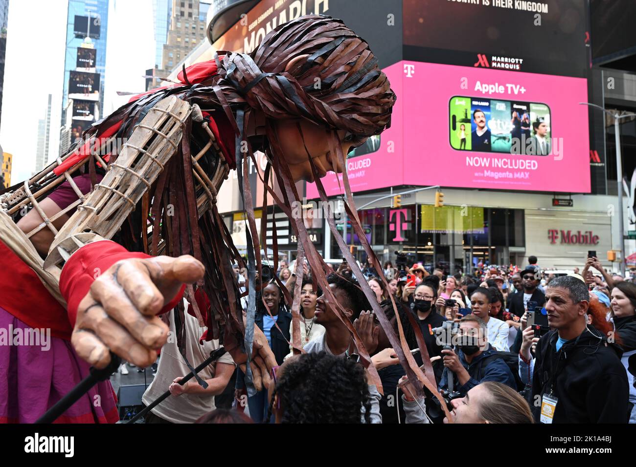 The 12-foot puppet known as "Little Amal" walks through Times Square as ...